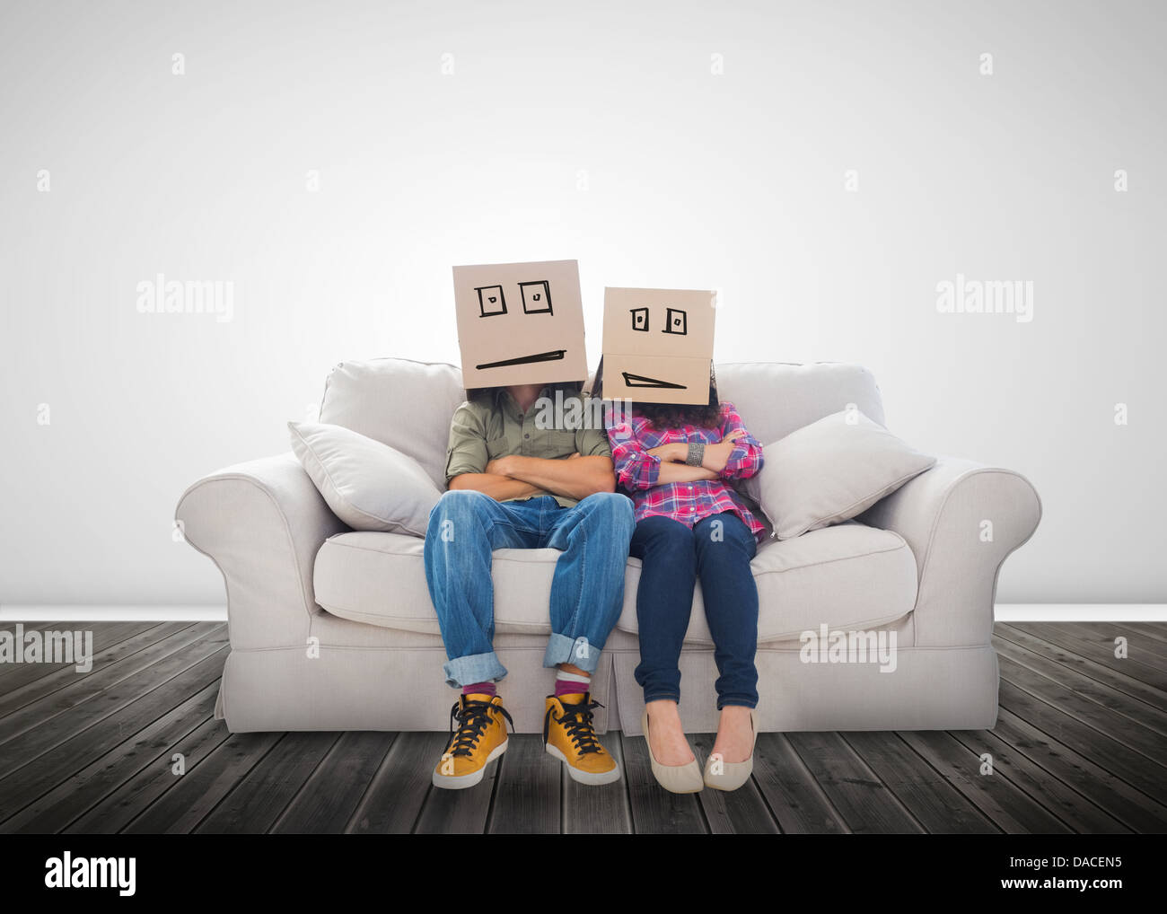 Couple wearing humorous boxes on their head Stock Photo - Alamy