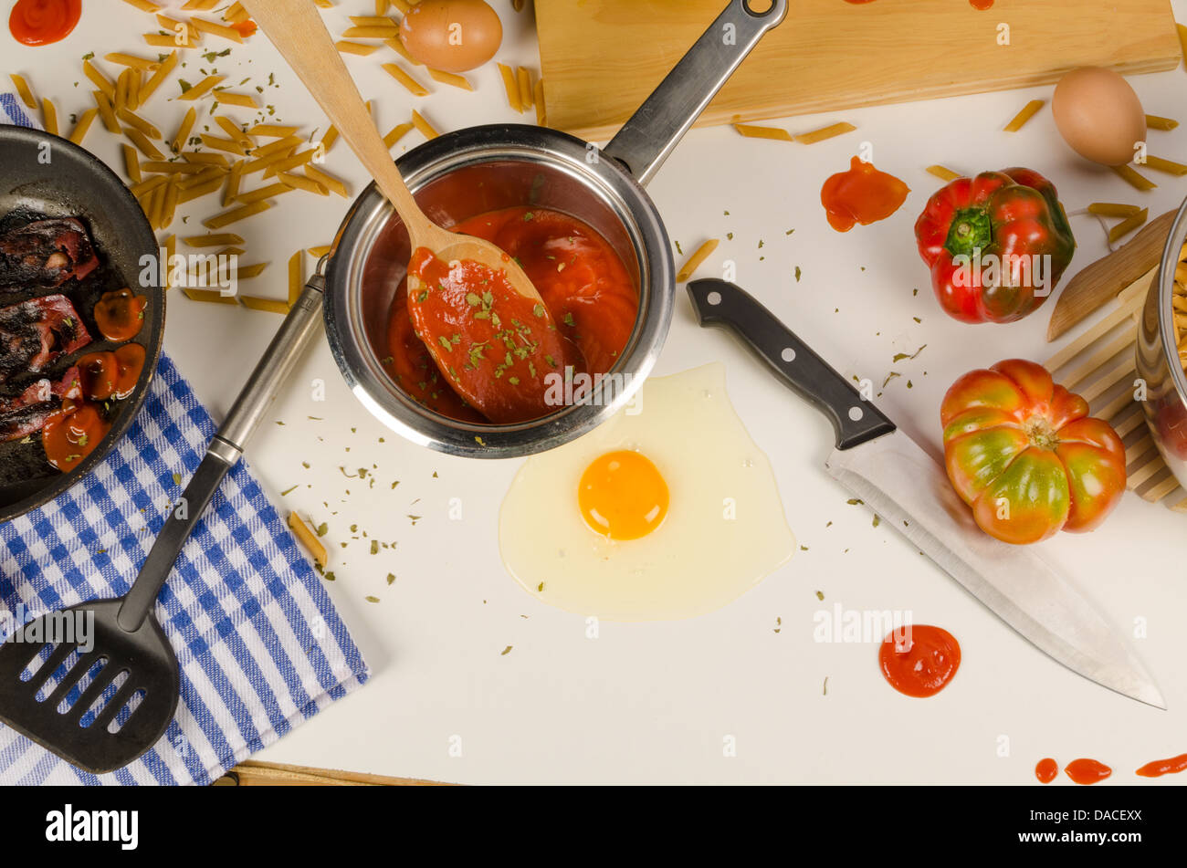 Chaotic kitchen table left by some untidy cook Stock Photo - Alamy