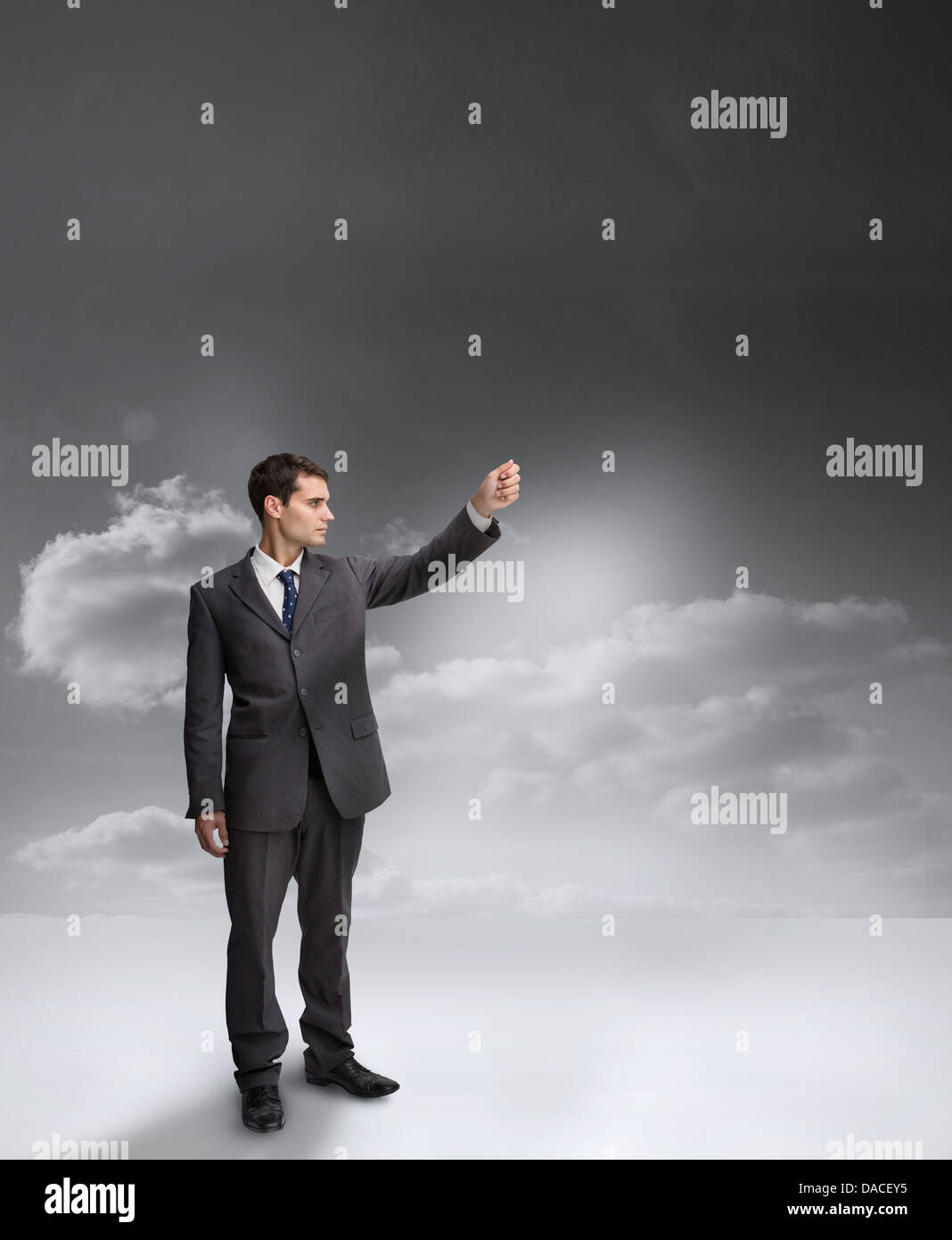 Businessman holding out his arm Stock Photo - Alamy