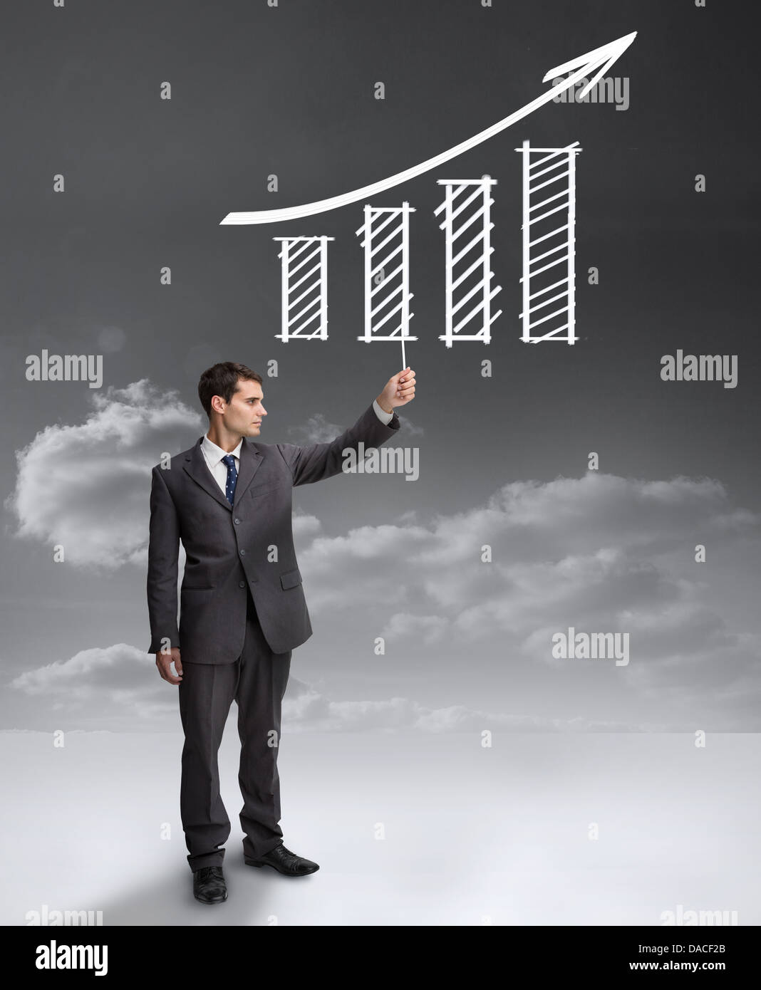 Handsome businessman holding a drawing of a growing chart Stock Photo ...