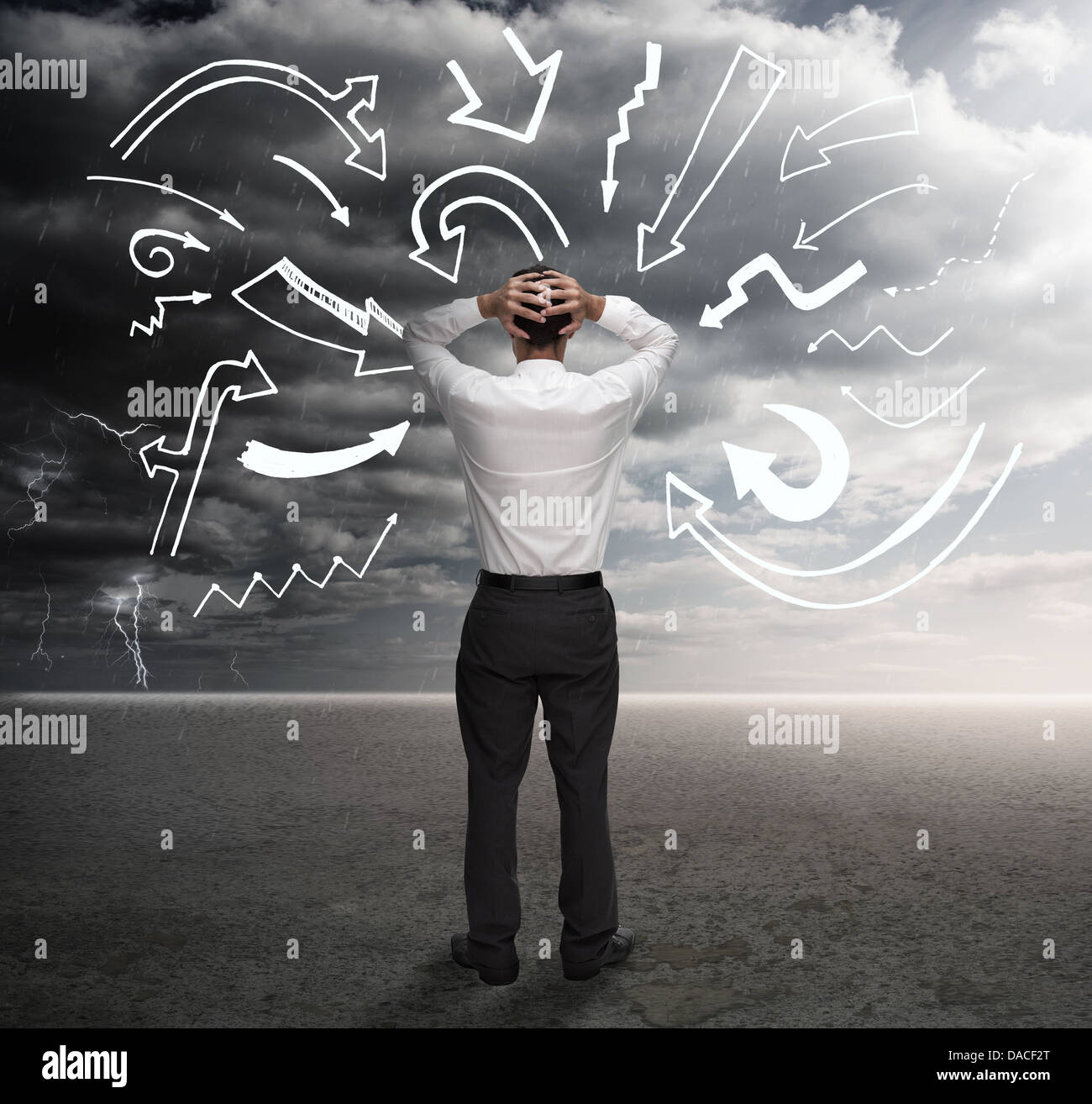 Anxious businessman looking at drawings Stock Photo - Alamy