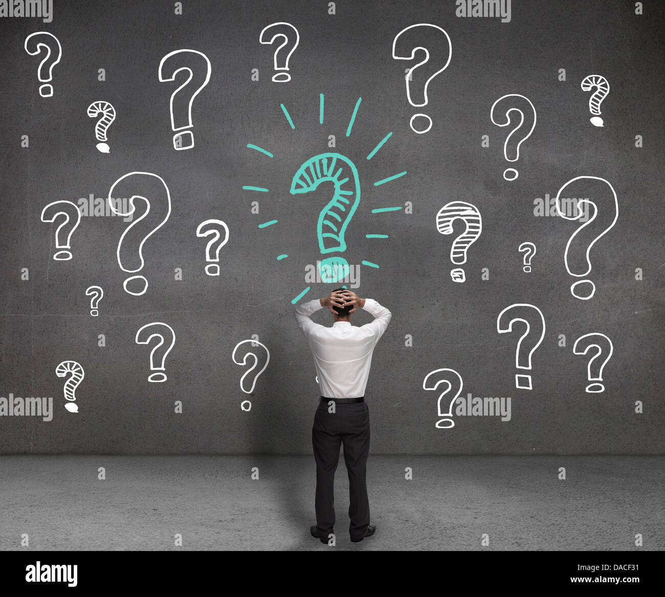 Anxious businessman looking at a drawing Stock Photo - Alamy