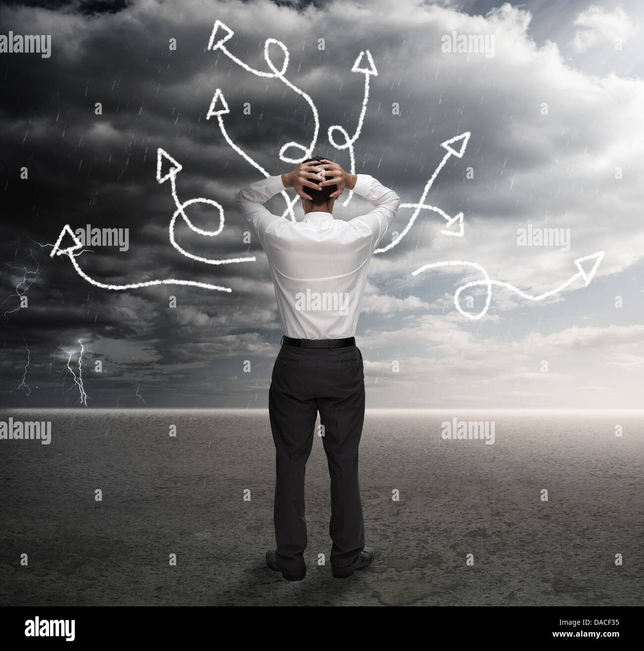 Frustrated businessman looking at a drawing Stock Photo - Alamy