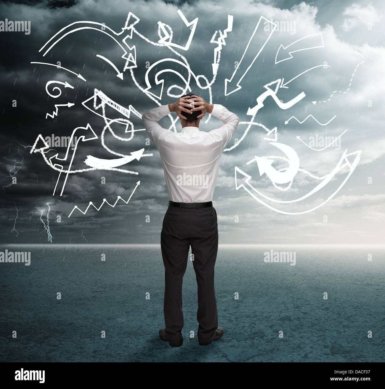 Stressed businessman looking at drawings Stock Photo - Alamy