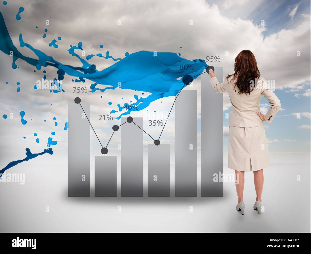 Creative businesswoman drawing a chart with paint splash Stock Photo ...