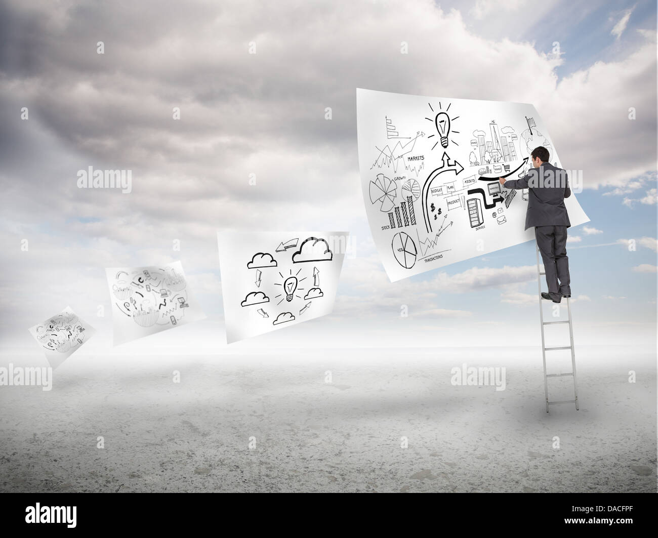 Businessman on a ladder drawing on a floating paper Stock Photo - Alamy