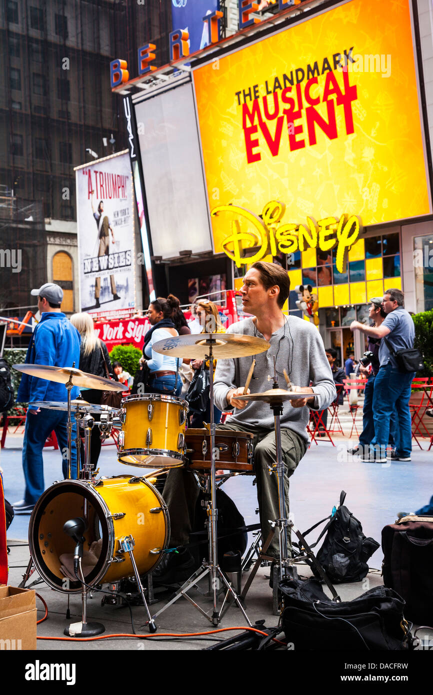 Man playing the drums outside the Disney Store, Times Square, Manhattan ...