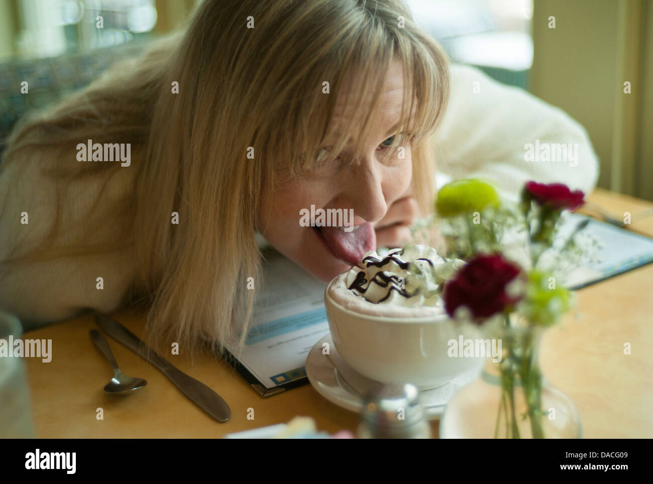 Woman licking whipping cream hi-res stock photography and images - Alamy