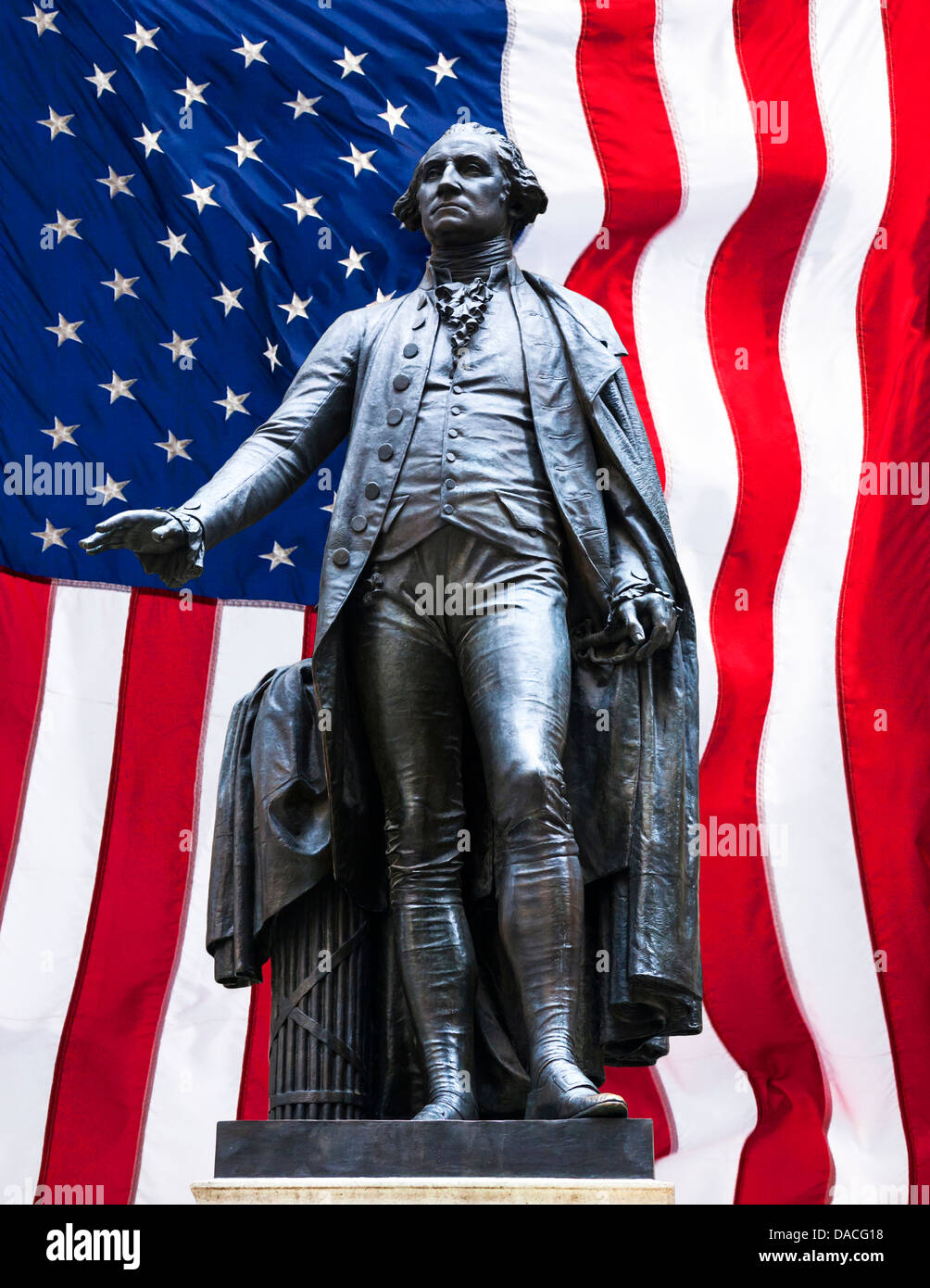 Statue of George Washington standing in front of the Stars and Stripes ...