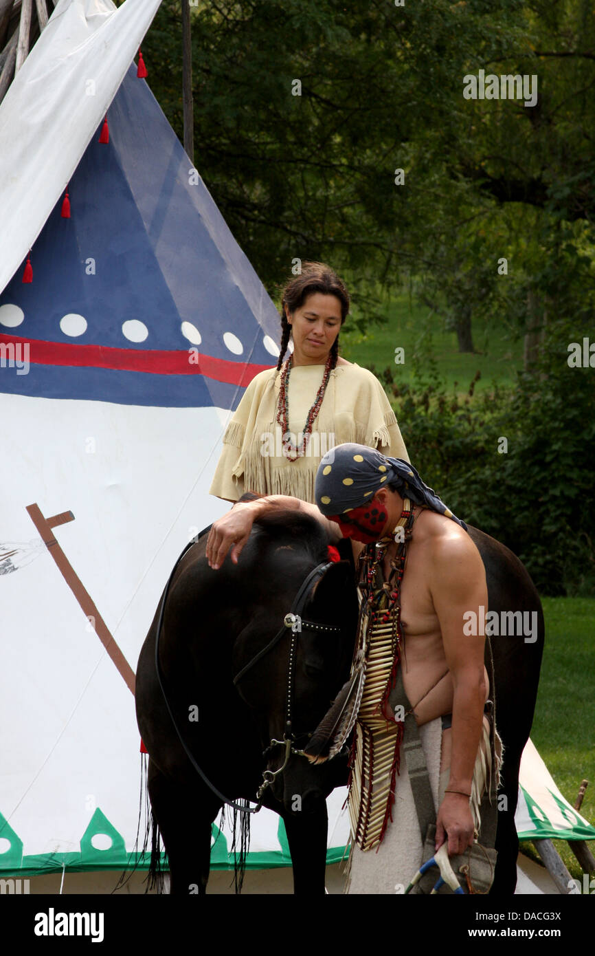Native American Indian man with woman on horseback Stock Photo - Alamy