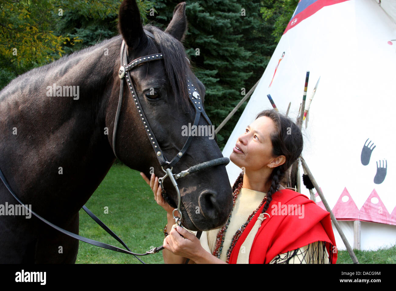 Native American Indian woman bonding with her horse Stock Photo - Alamy
