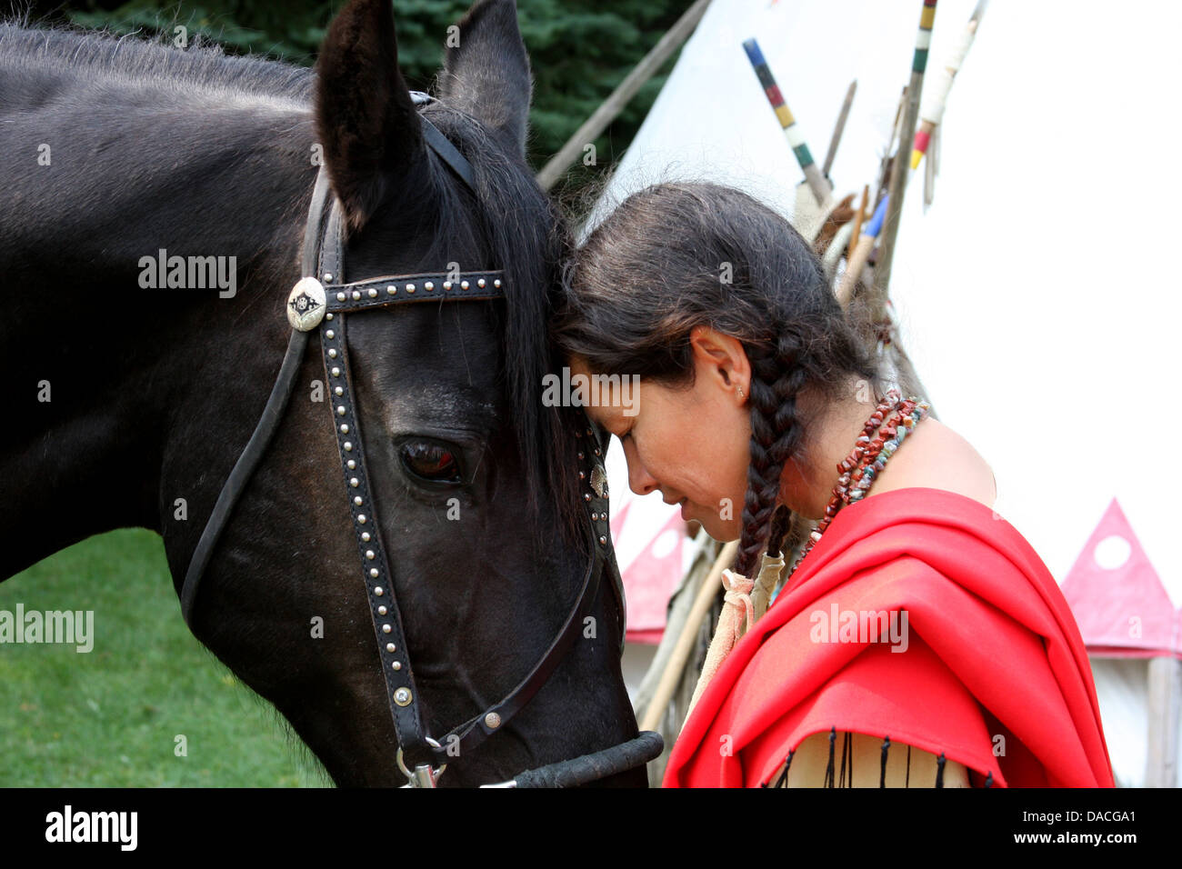 Native American Indian woman bonding with her horse Stock Photo - Alamy