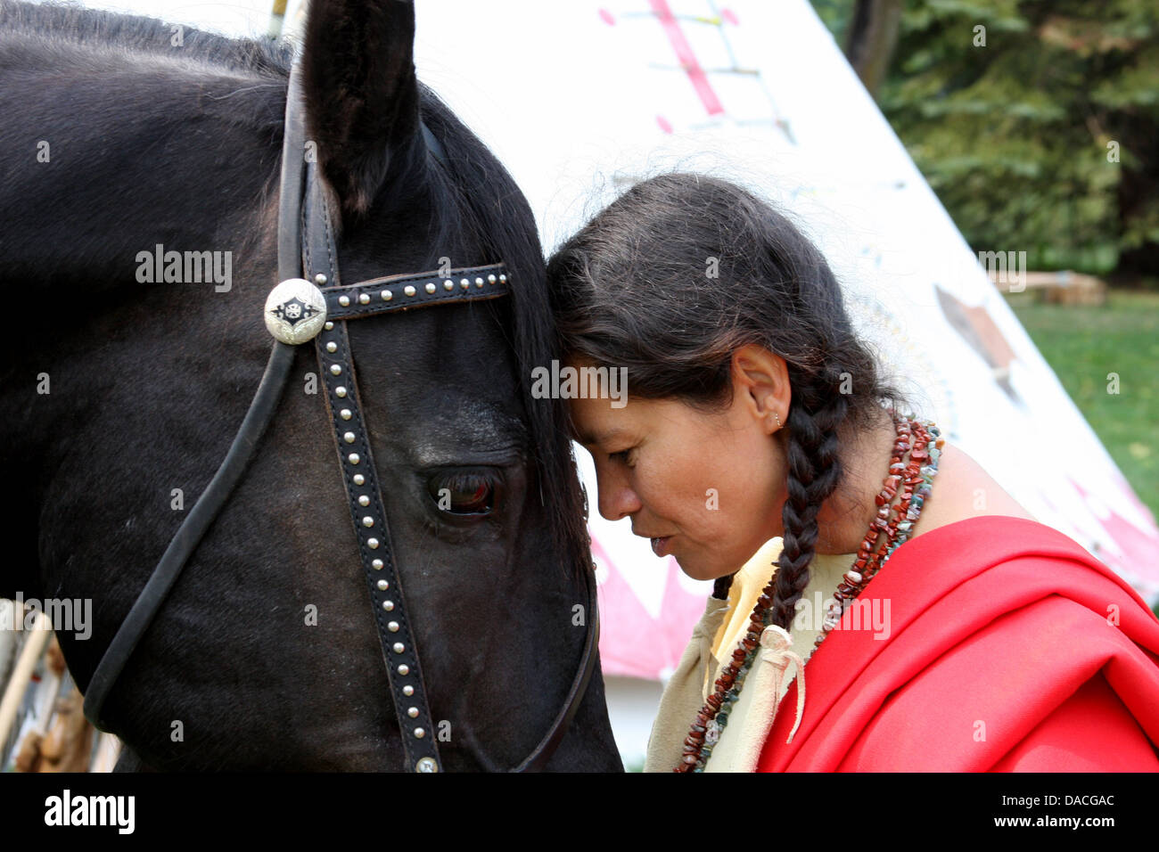 Native American Indian woman bonding with her horse Stock Photo - Alamy