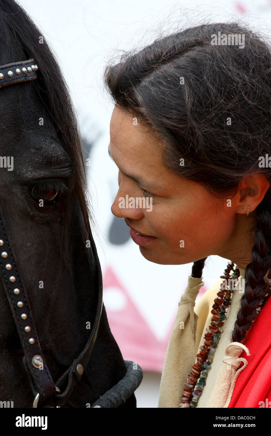 Native American Indian woman bonding with her horse Stock Photo - Alamy