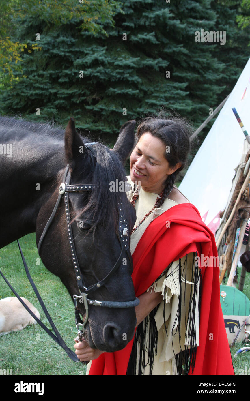 Native American Indian woman bonding with her horse Stock Photo - Alamy