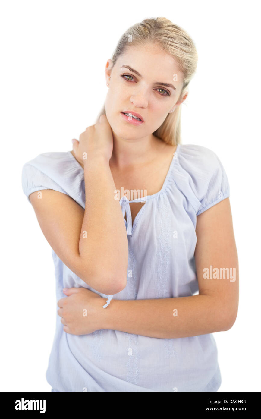 Blonde woman has a bad neck Stock Photo - Alamy