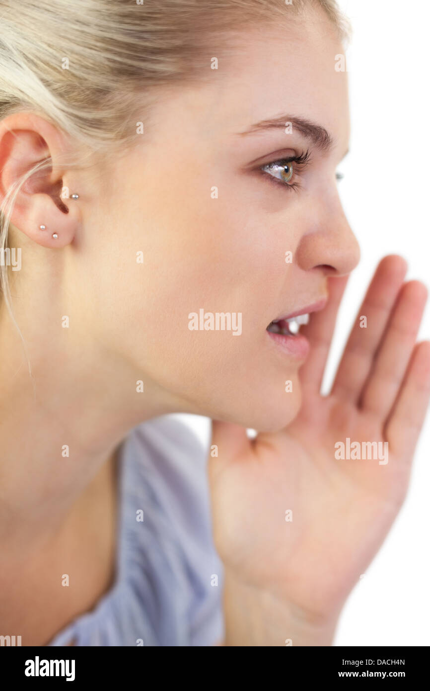 Young woman telling a secret Stock Photo - Alamy