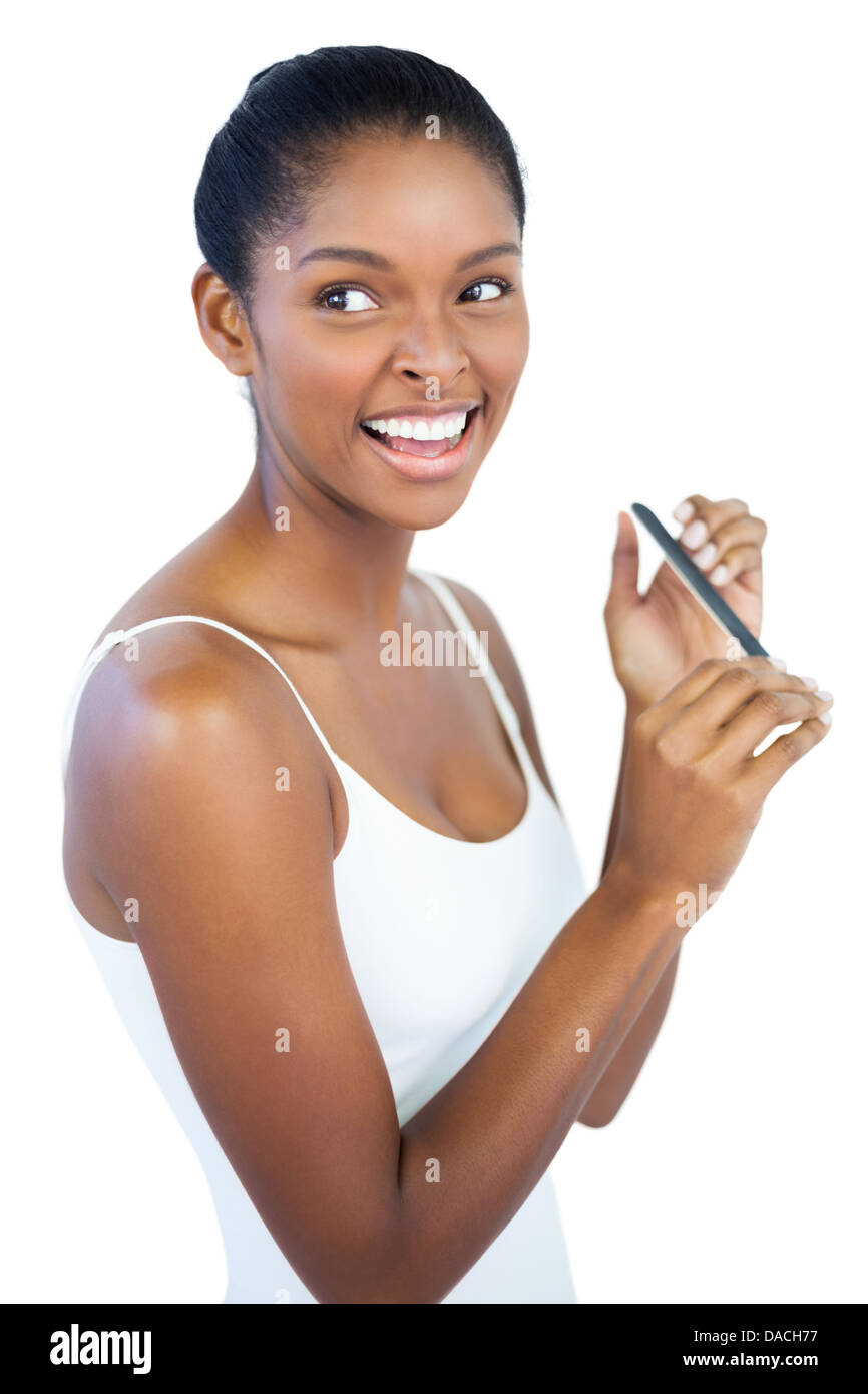 Woman file filing nails hi-res stock photography and images - Alamy