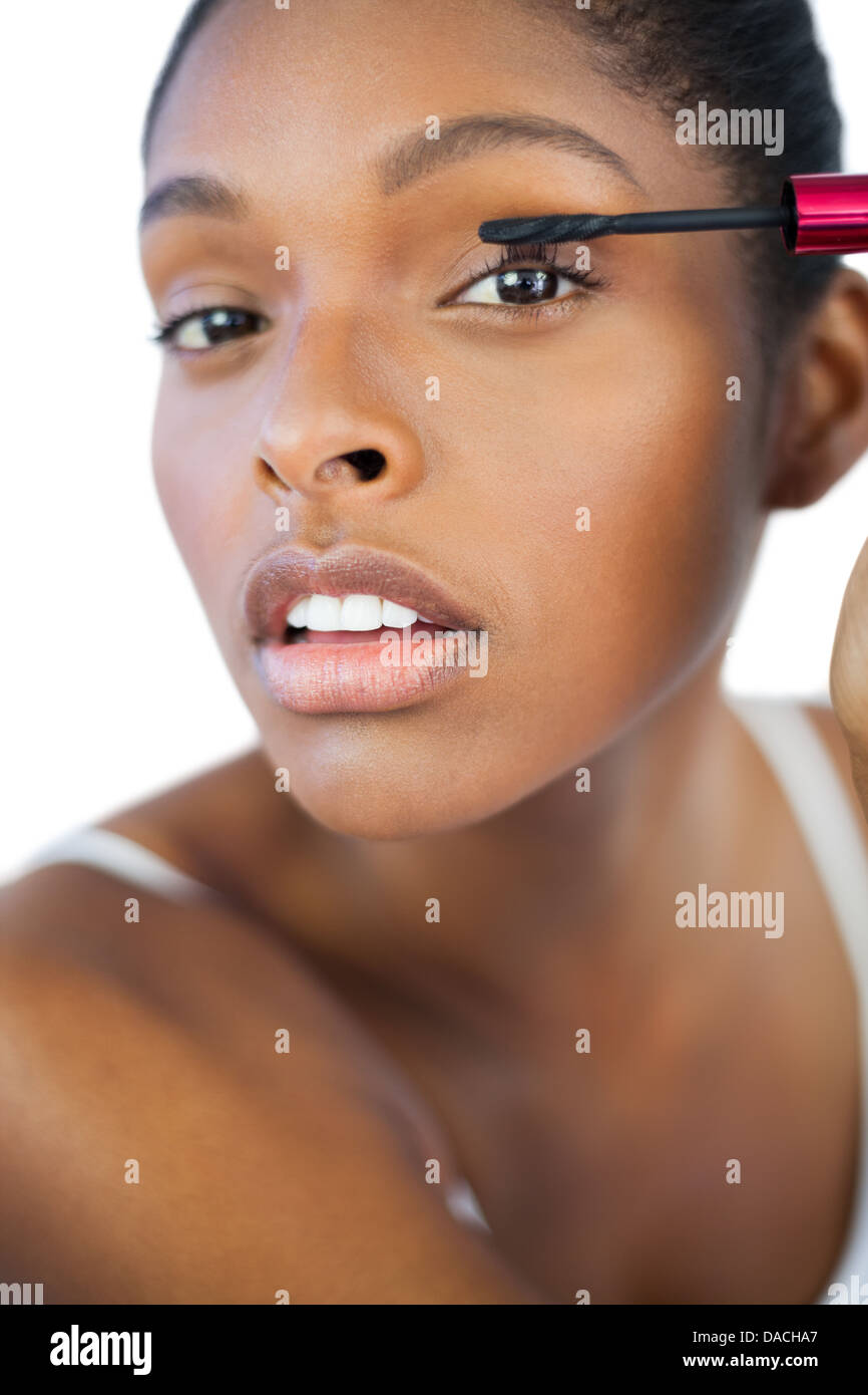 Young woman using mascara for her eyelashes Stock Photo - Alamy