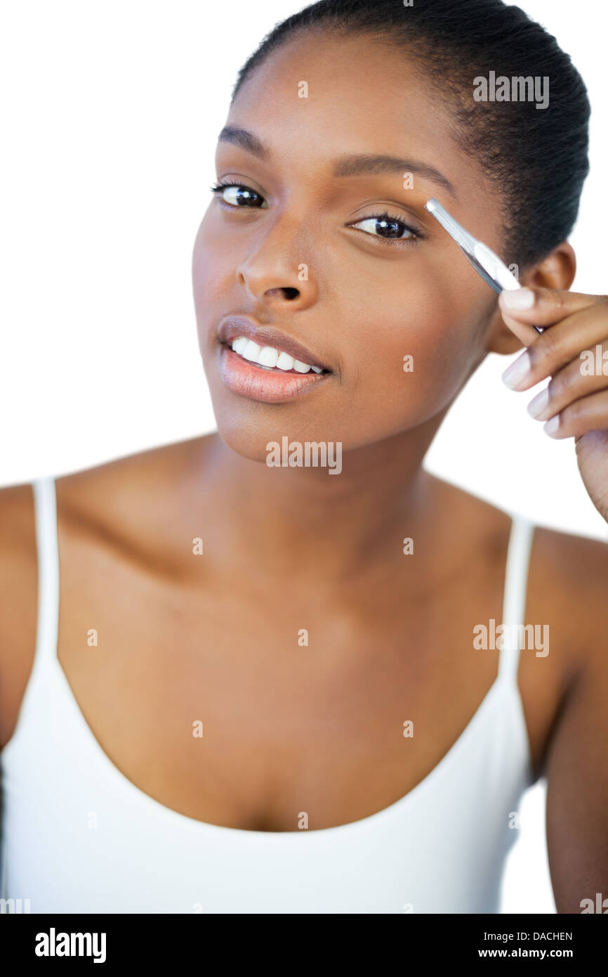 Young woman using her tweezers Stock Photo - Alamy