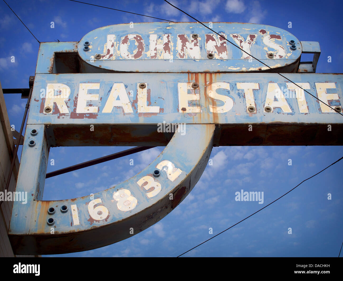 Dilapidated sign for a real estate business that has since closed in ...