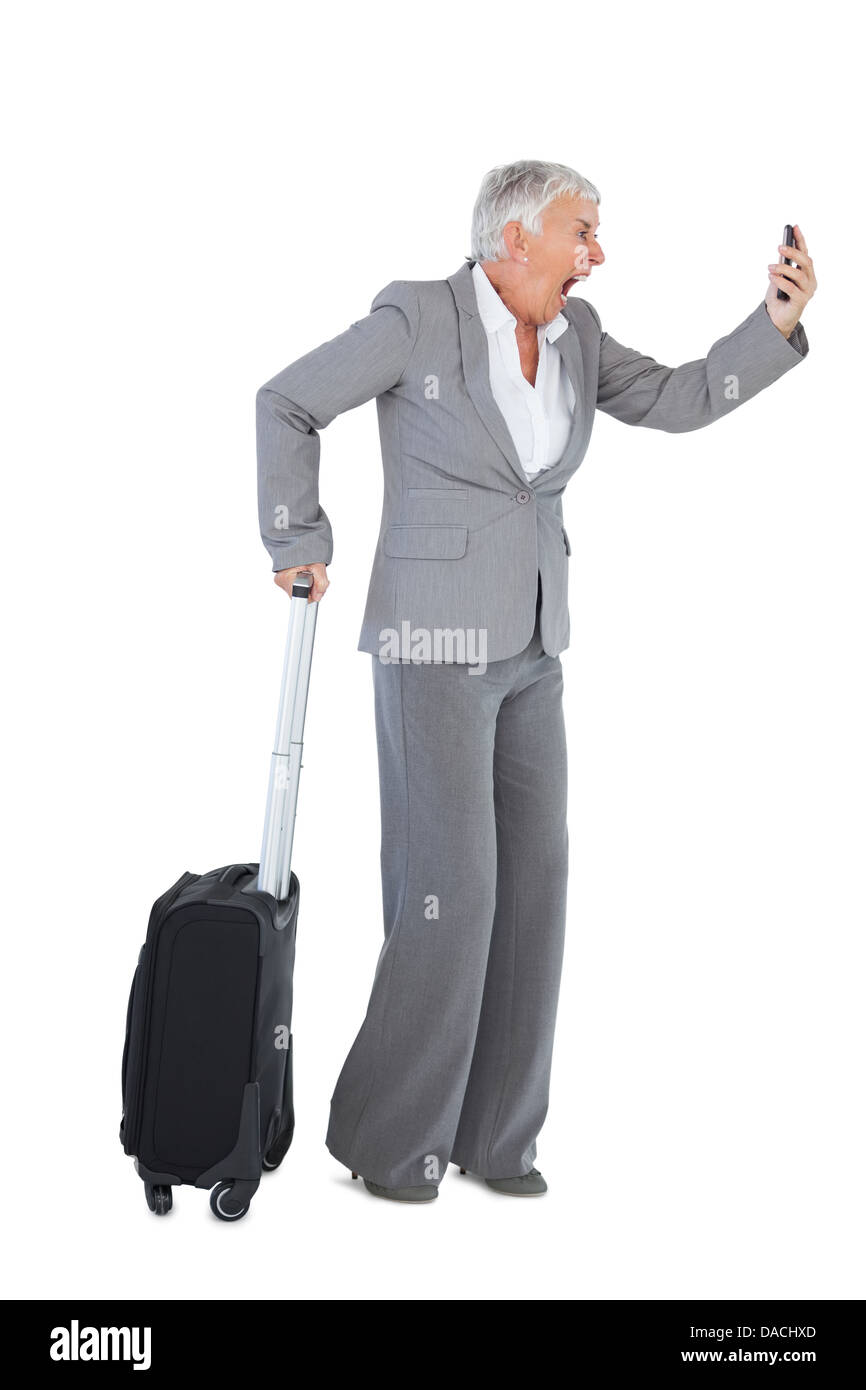 Furious businesswoman screaming during a call Stock Photo - Alamy