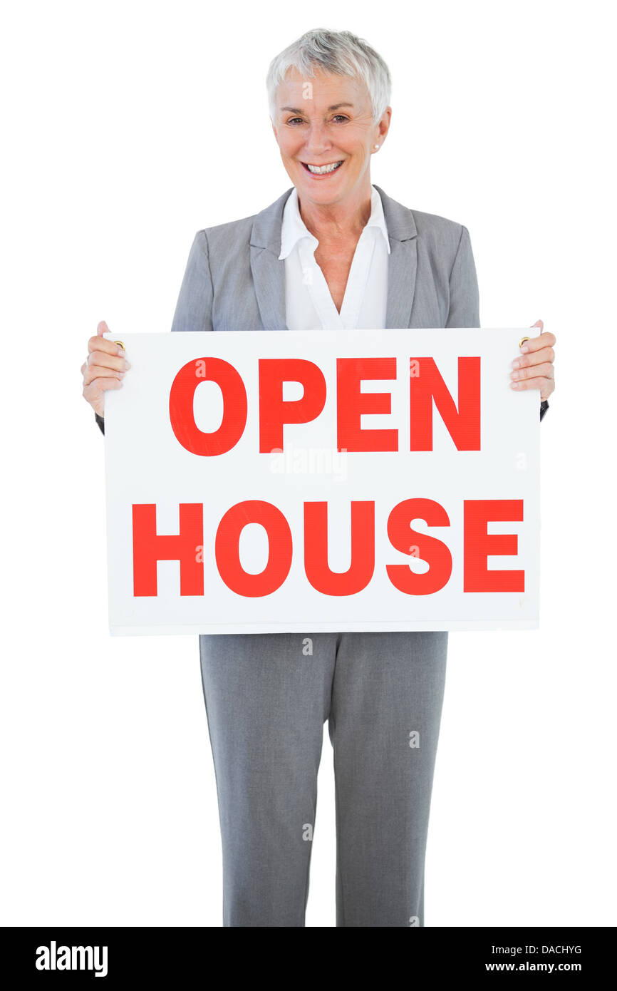 Estate agent holding sign for open house Stock Photo - Alamy