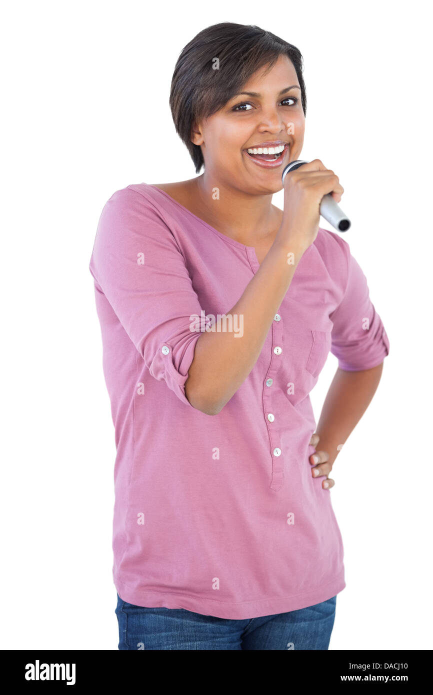 Woman singing with her microphone Stock Photo - Alamy