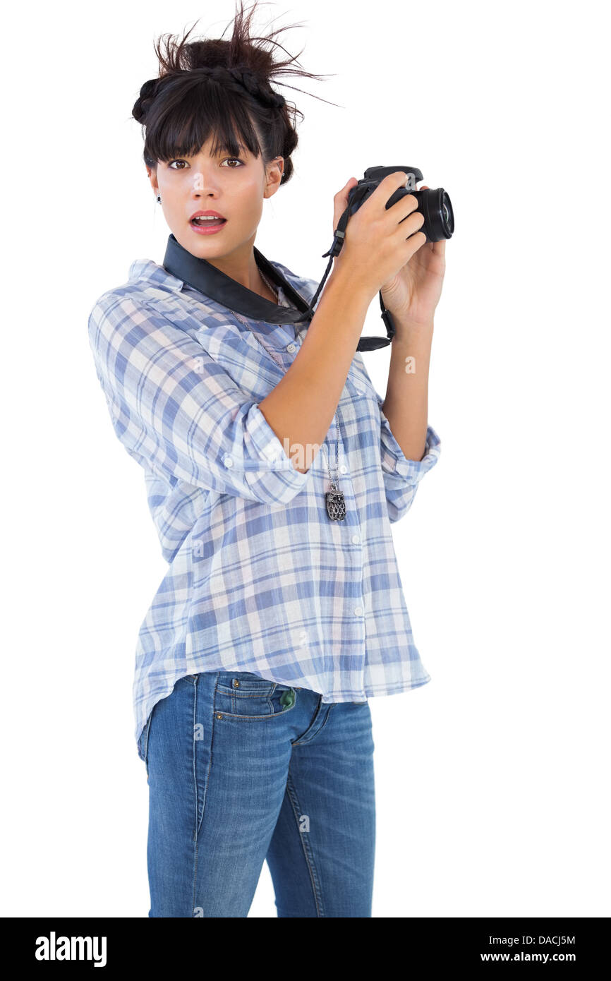 Astonished young woman taking picture with her camera Stock Photo - Alamy