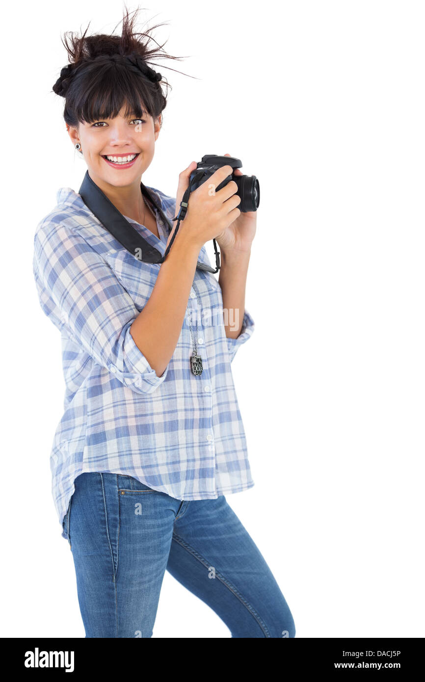 Happy young woman taking picture with her camera Stock Photo - Alamy