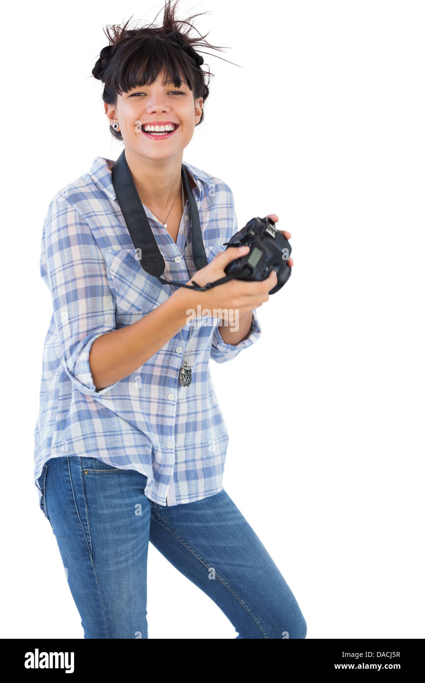Cheerful young woman taking picture with her camera Stock Photo - Alamy