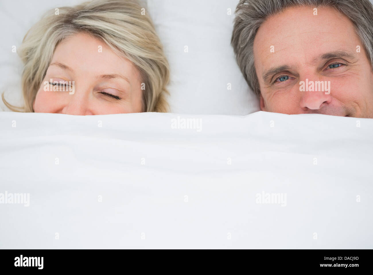 Under covers bed asleep hi-res stock photography and images - Alamy