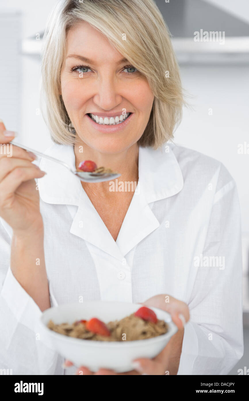 Woman mature eating spoon hi-res stock photography and images - Alamy