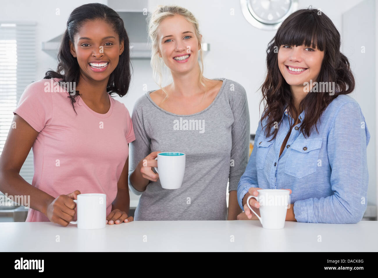 Friends having coffee together Stock Photo - Alamy