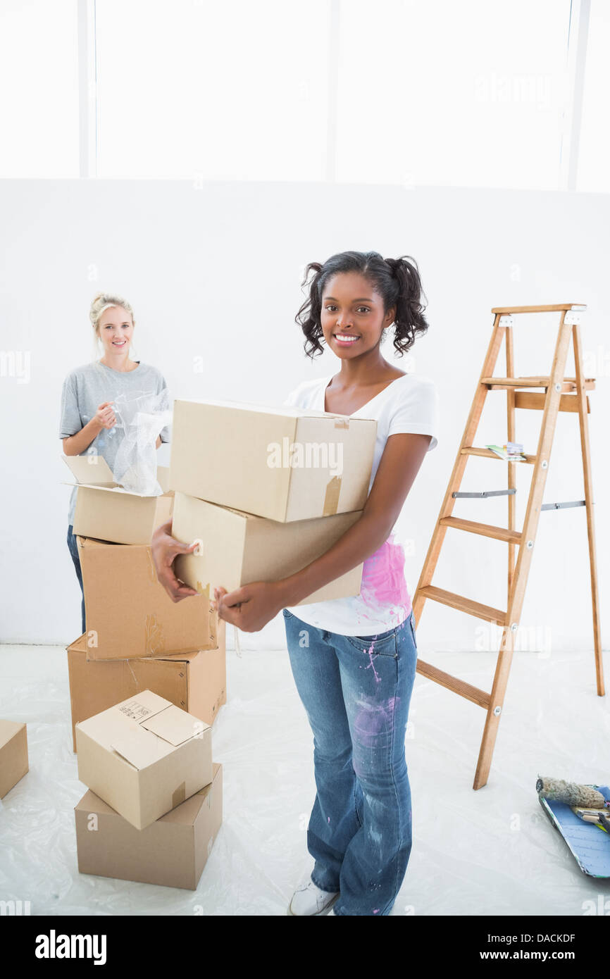 Young housemates moving into new home Stock Photo - Alamy