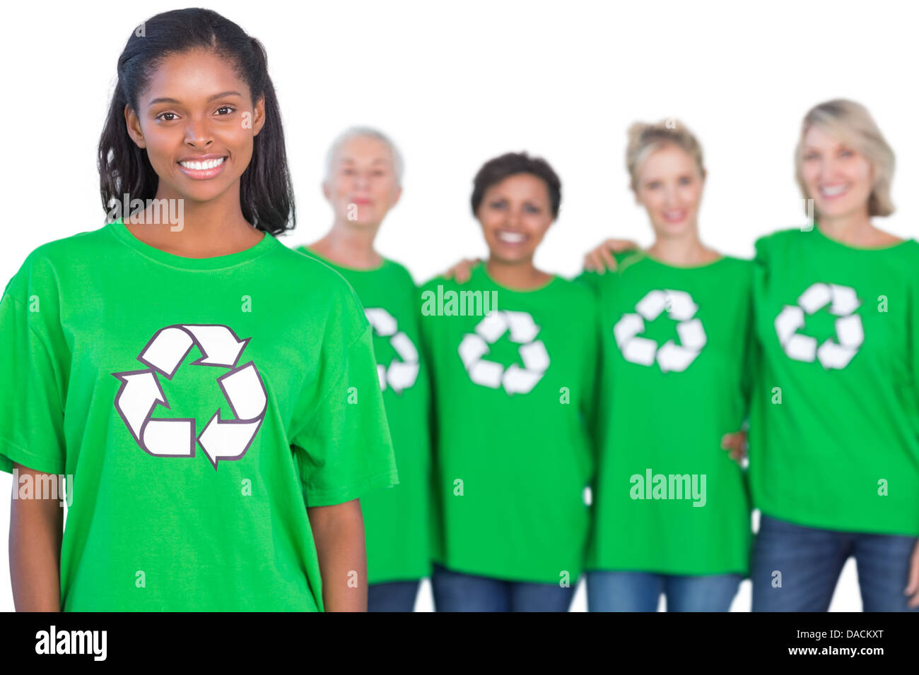 Team of female environmental activists smiling at camera Stock Photo ...