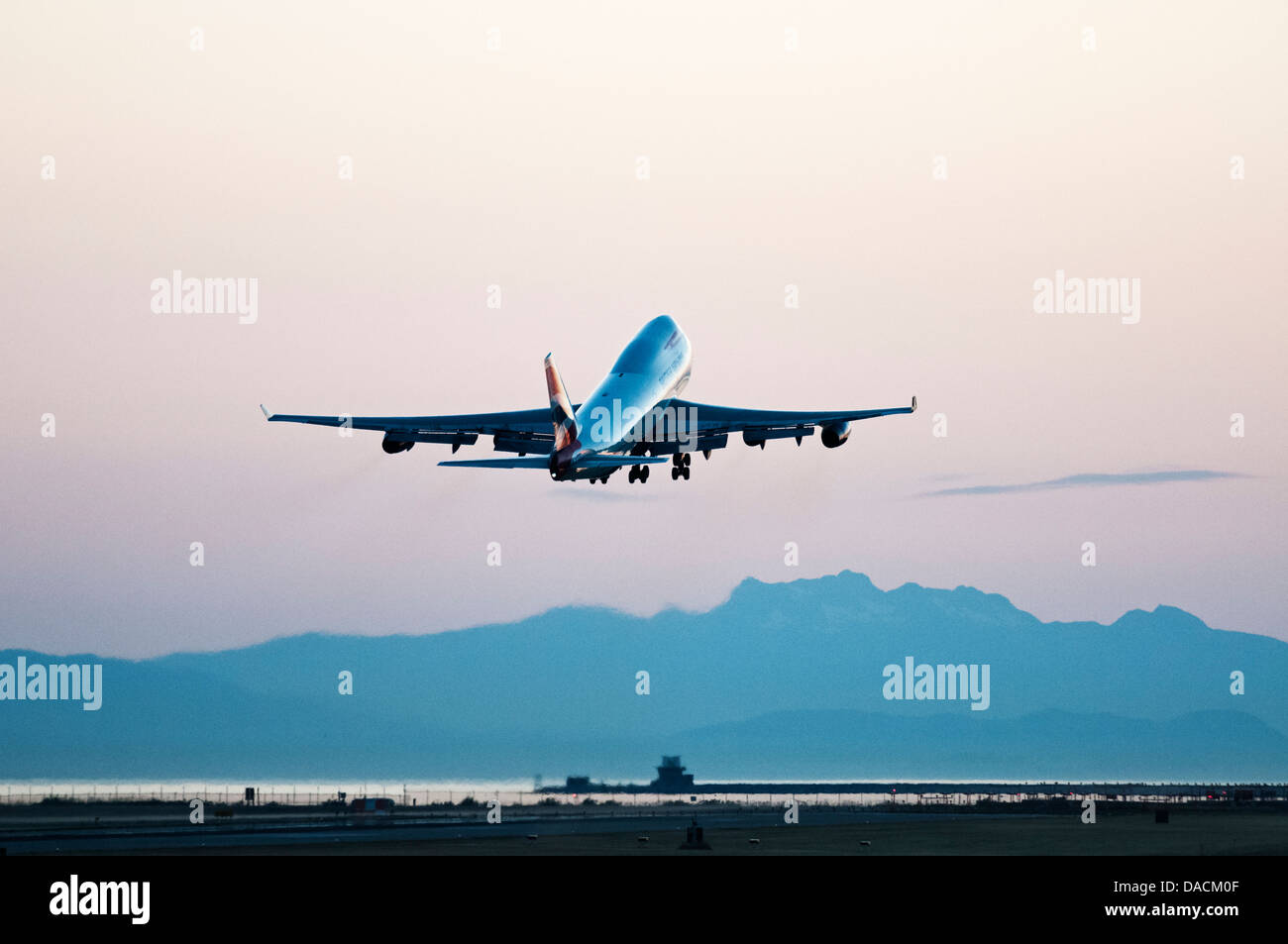 A British Airways Boeing 747-400 wide-body jumbo jet airliner departs ...