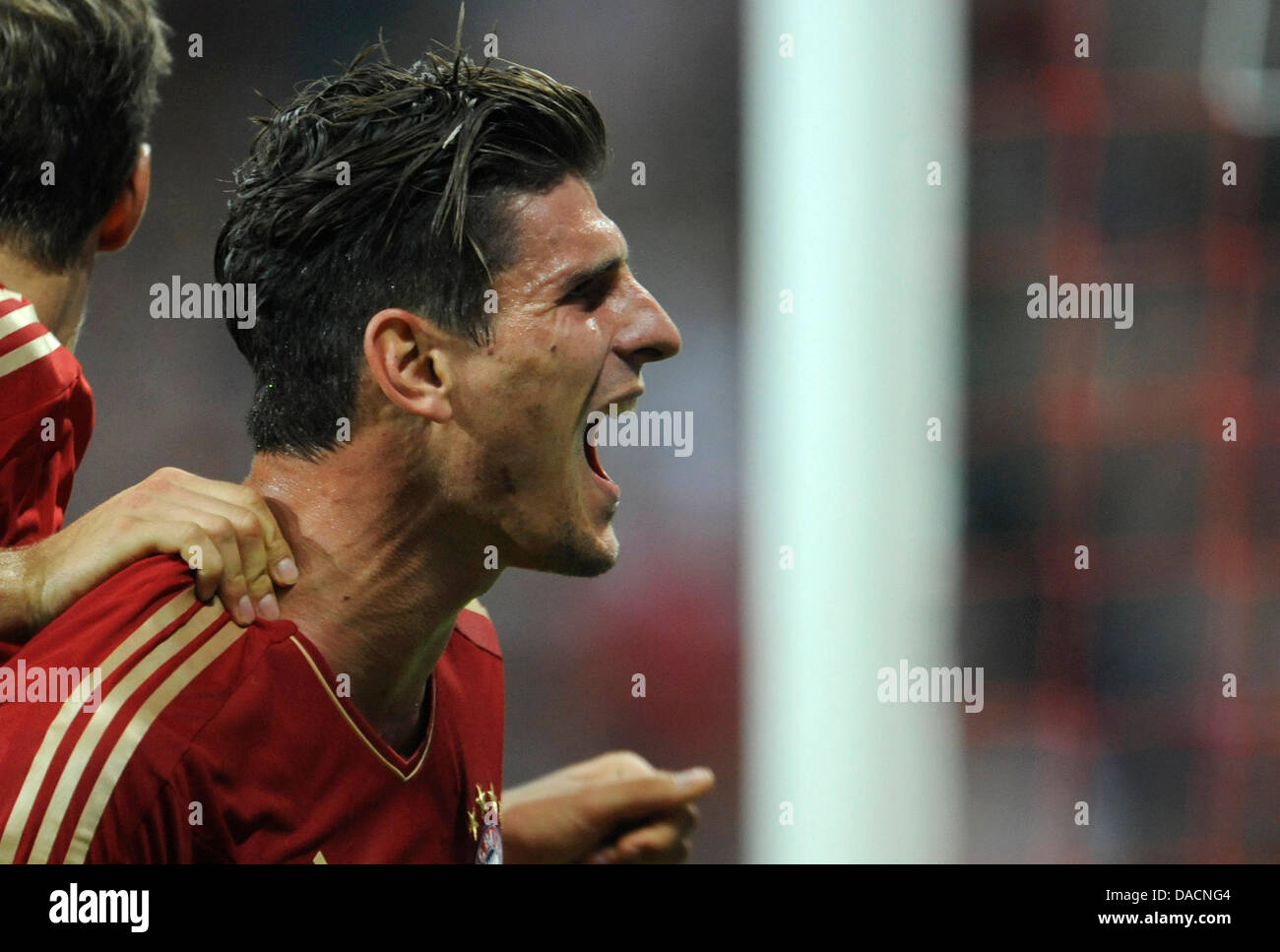 Munich's Mario Gomez celebrates after scoring the 1-0 goal during the ...
