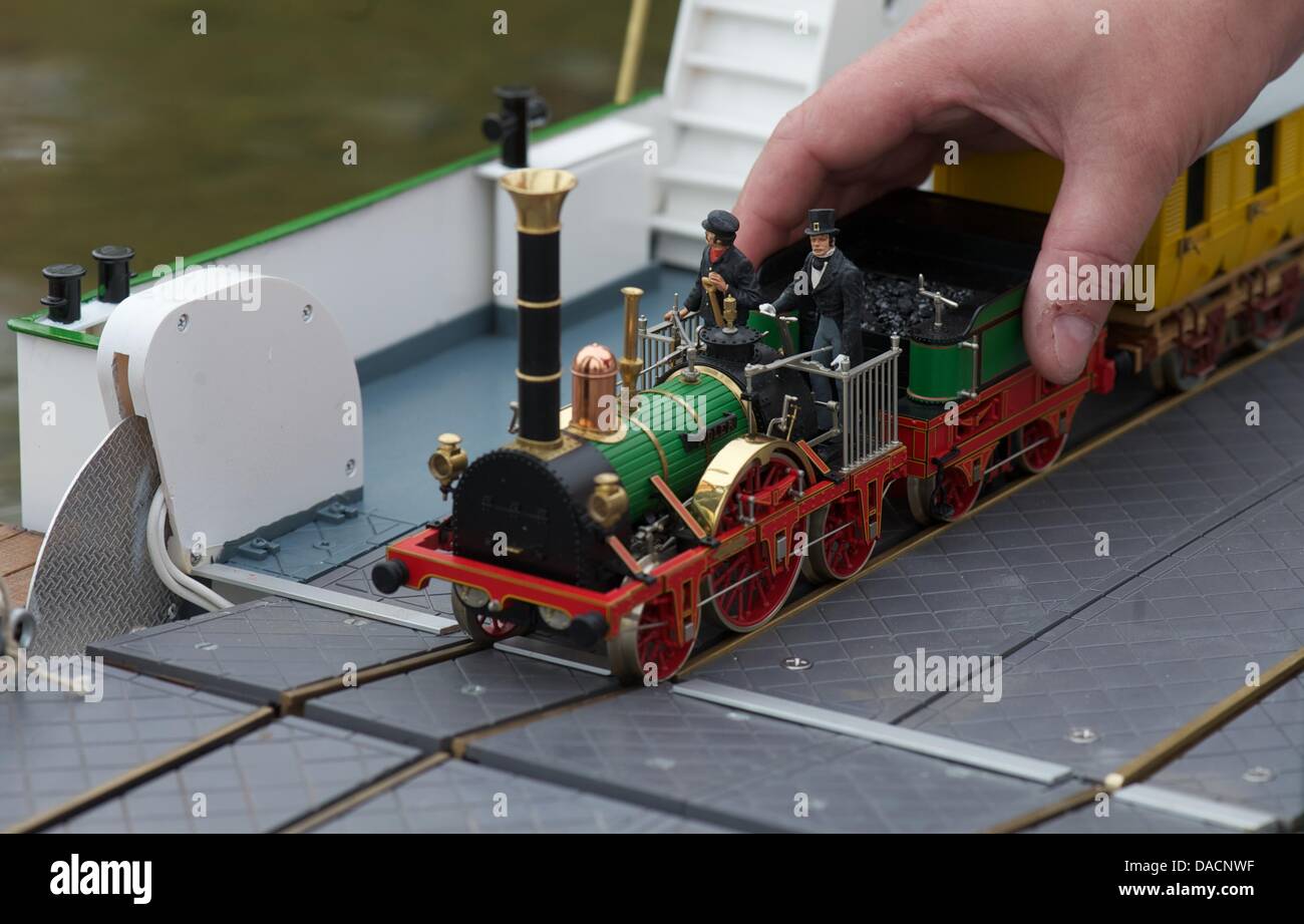 The legendary locomotive "Adler" at a scale of 1:22.5 is put on a track ...