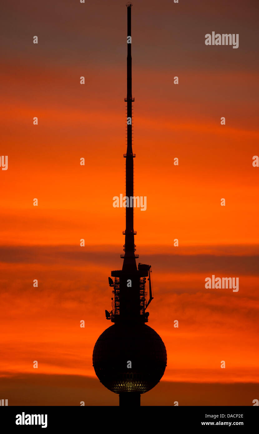A red coloured evening sky is seen behind the television tower at ...
