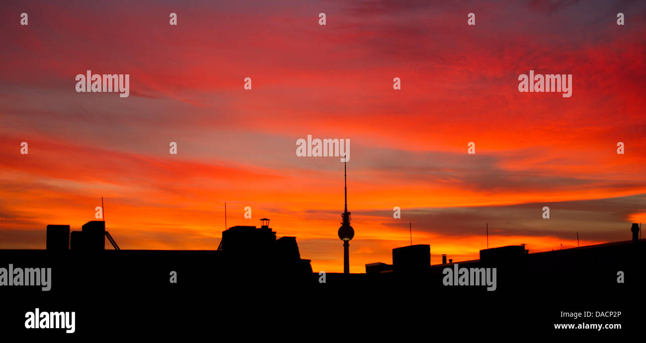 A red coloured evening sky is seen behind the television tower at ...