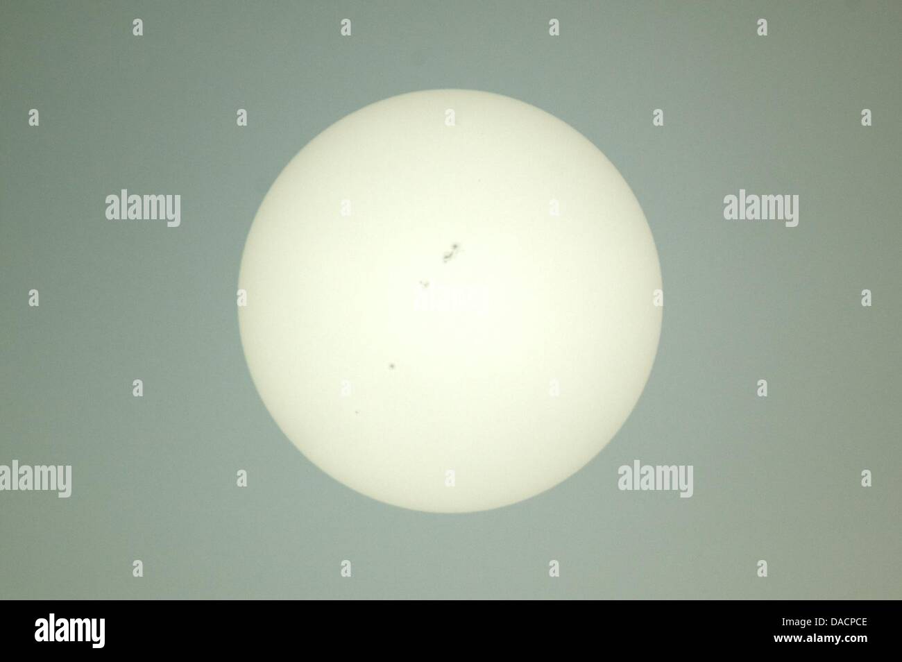The sun has large sunspots named AR1302, photo taken in Leipzig ...