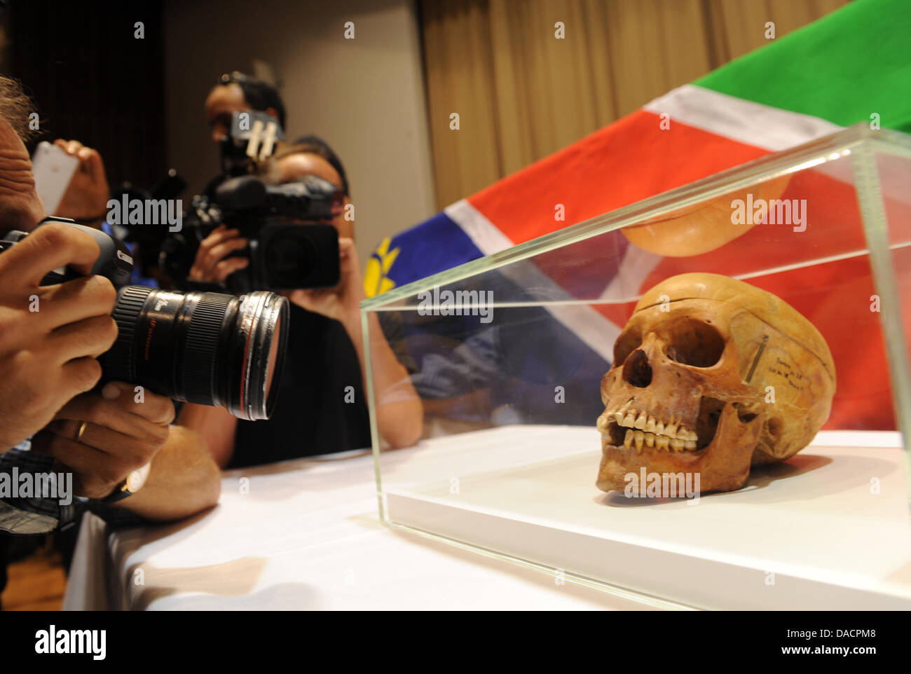 A skull is being photographed during the handover of 20 skulls to the ...