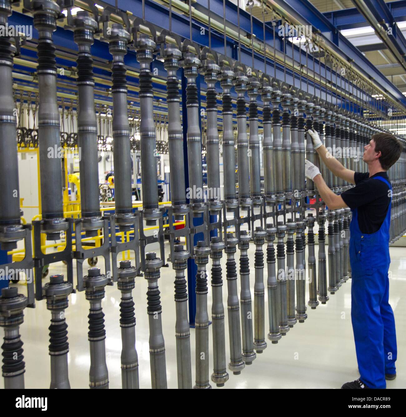 Machine operator Kai Berthold checks the quality of auto propulsion ...