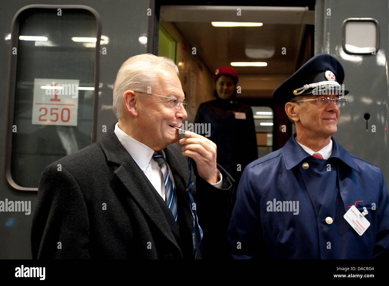 Head of German railway company Deutsche Bahn Ruediger Grube (L) gives ...