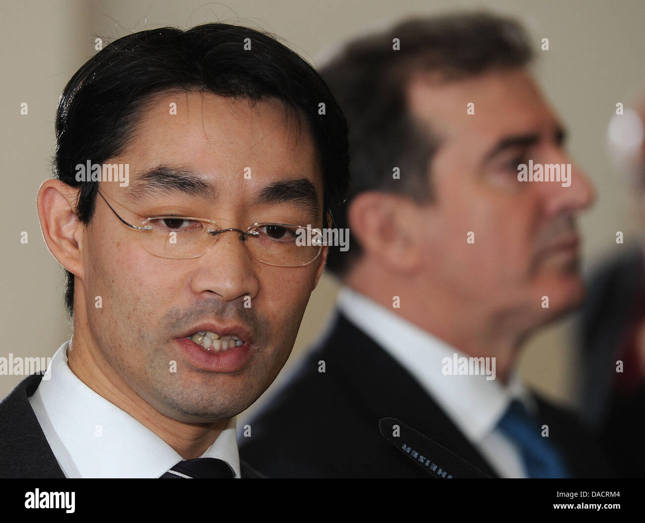 German Economy Minister Philipp Roesler (L) and his Greek counterpart ...