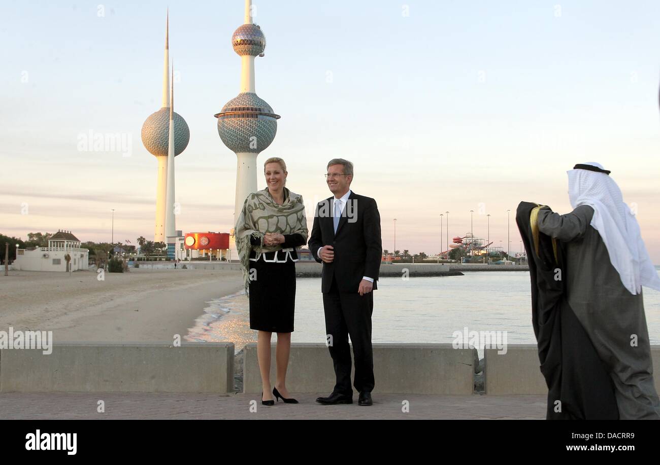 German President Christian Wulff and his wife Bettina stand on the ...