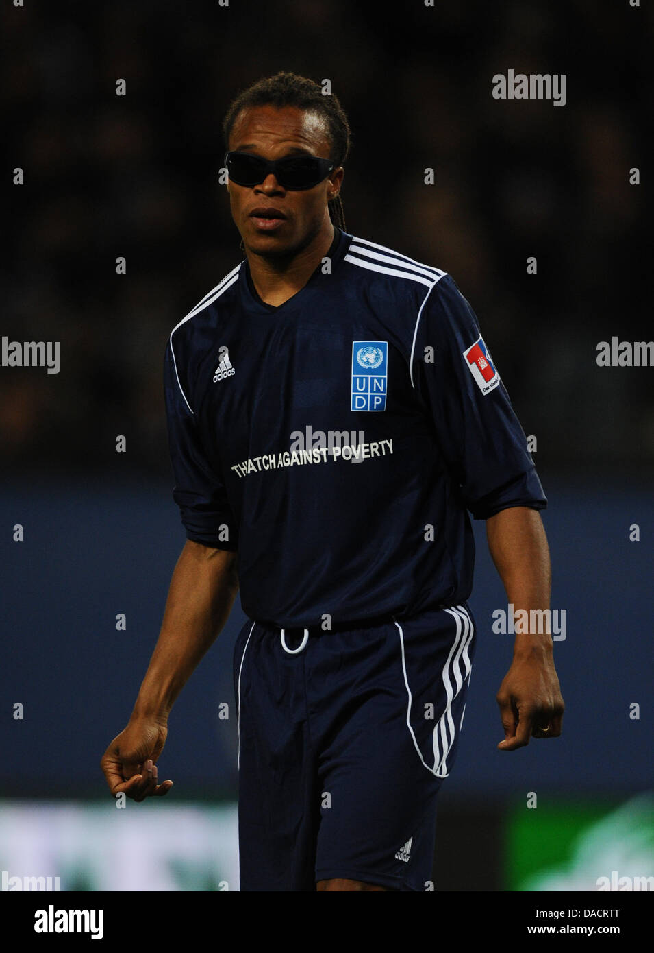 Edgar Davids of "Team Ronaldo, Zidane and friends" stands on the pitch ...