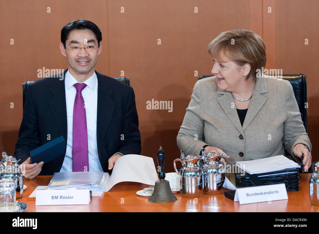 FDP leader Philipp Roesler and German Chancellor Angela Merkel (CDU ...