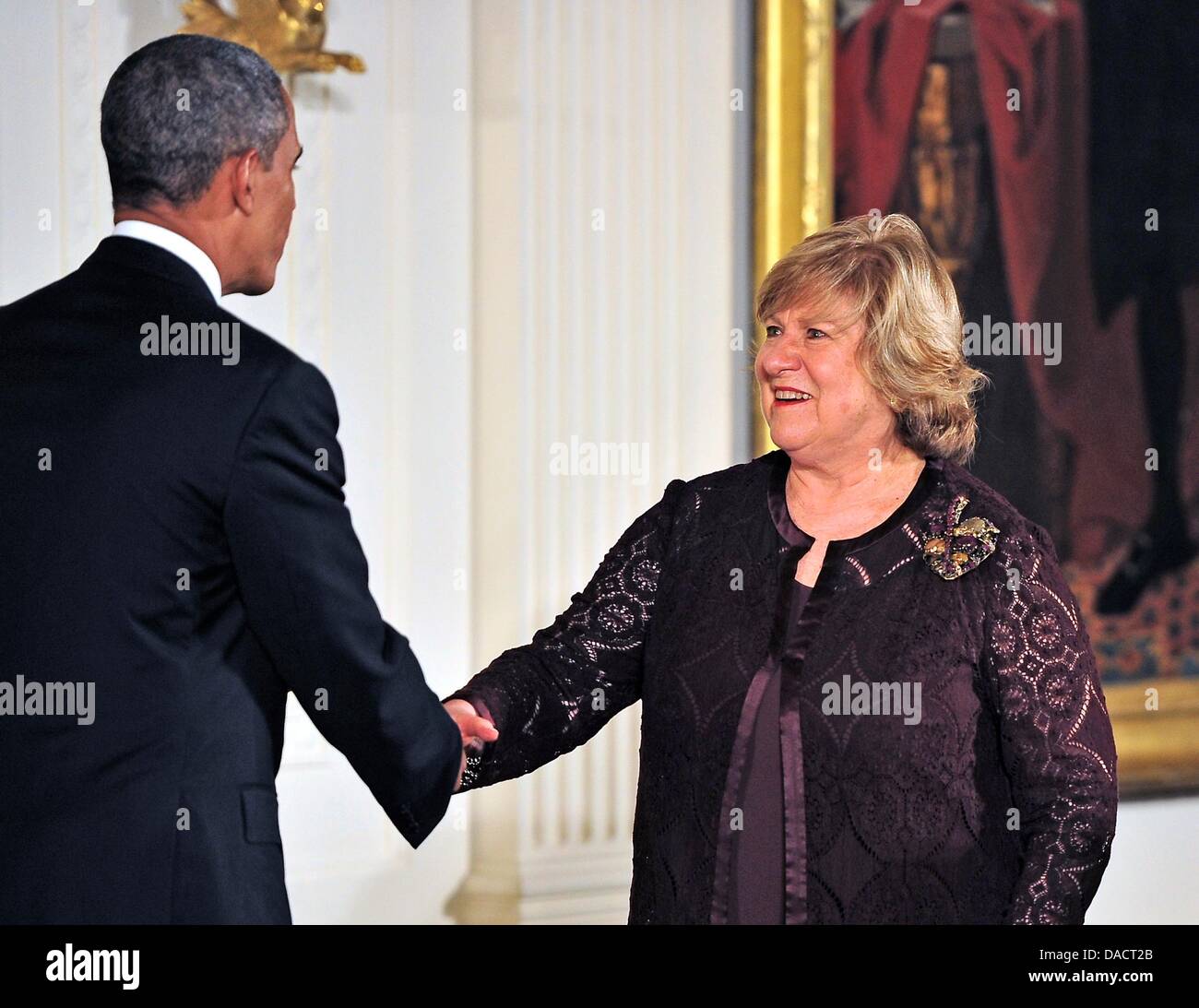 Philanthropist Lin Arison shakes hands with United States President ...